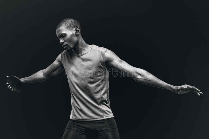 Composite Image of Front View of Sportsman Practising Discus Throw ...