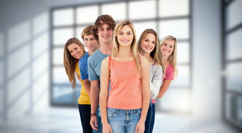 Composite Image of Full Length Shot of a Smiling Group Standing Behind ...