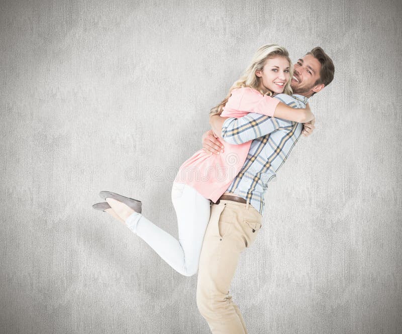 Composite Image of Handsome Man Picking Up and Hugging His Girlfriend ...