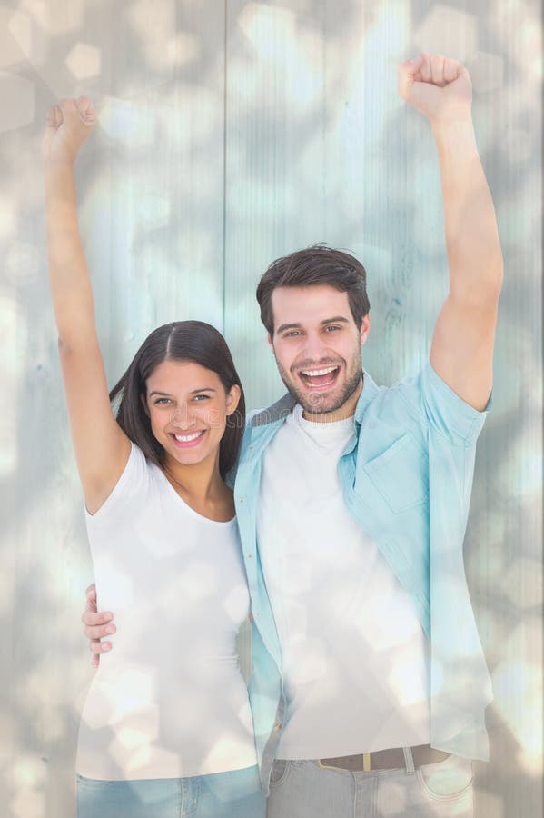 Composite Image of Happy Casual Couple Cheering Together Stock Image ...