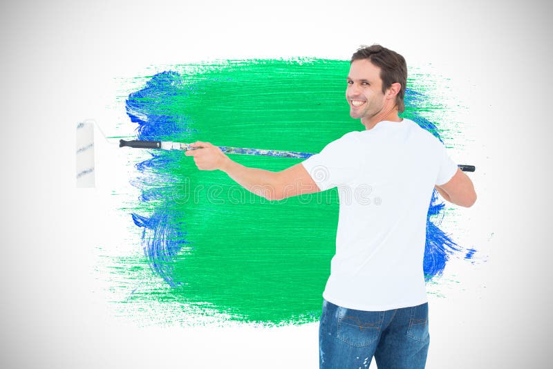 Composite Image of Happy Man Using Paint Roller Stock Photo - Image of ...
