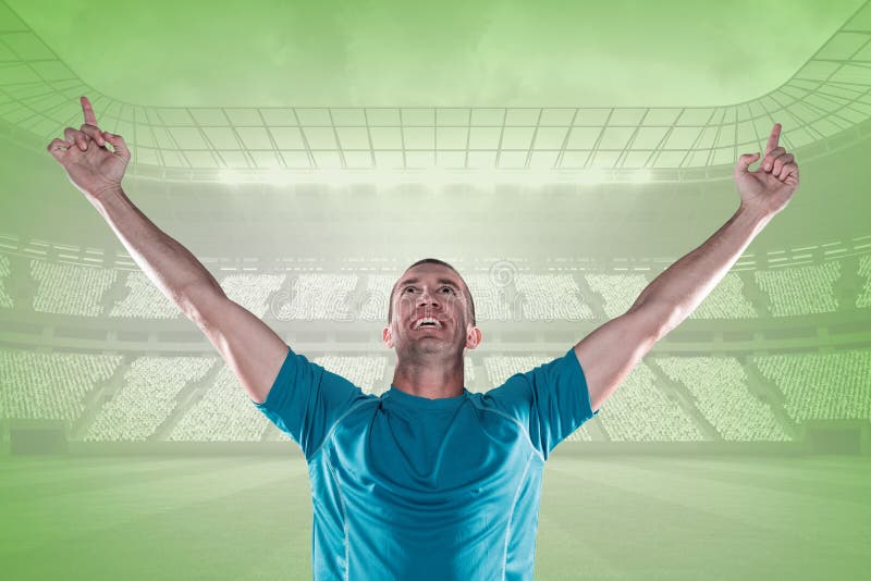 Composite Image of Happy Rugby Player with Arms Raised Stock Photo ...