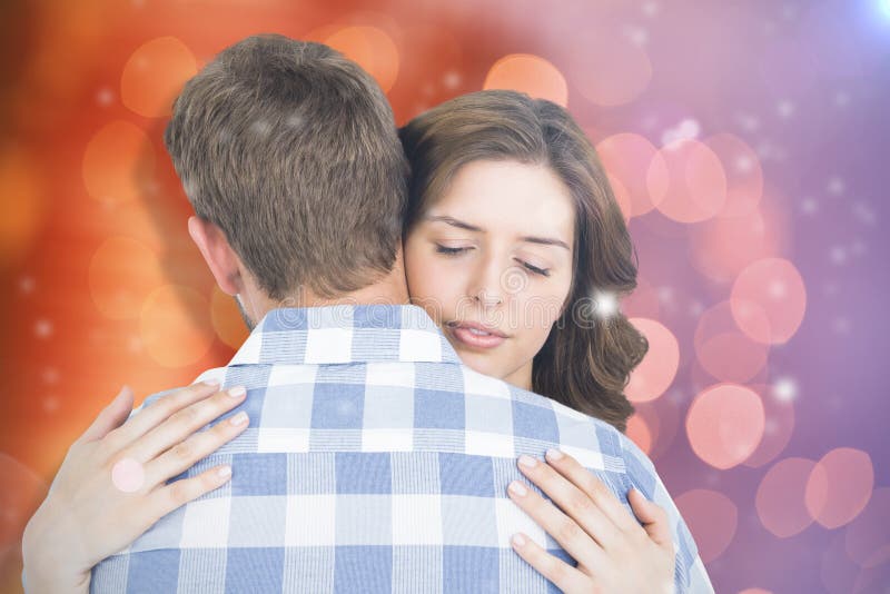 Composite Image of Happy Young Couple Cuddling Each Other Stock Photo ...