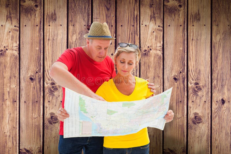 Composite Image of Lost Tourist Couple Using Map Stock Image - Image of ...