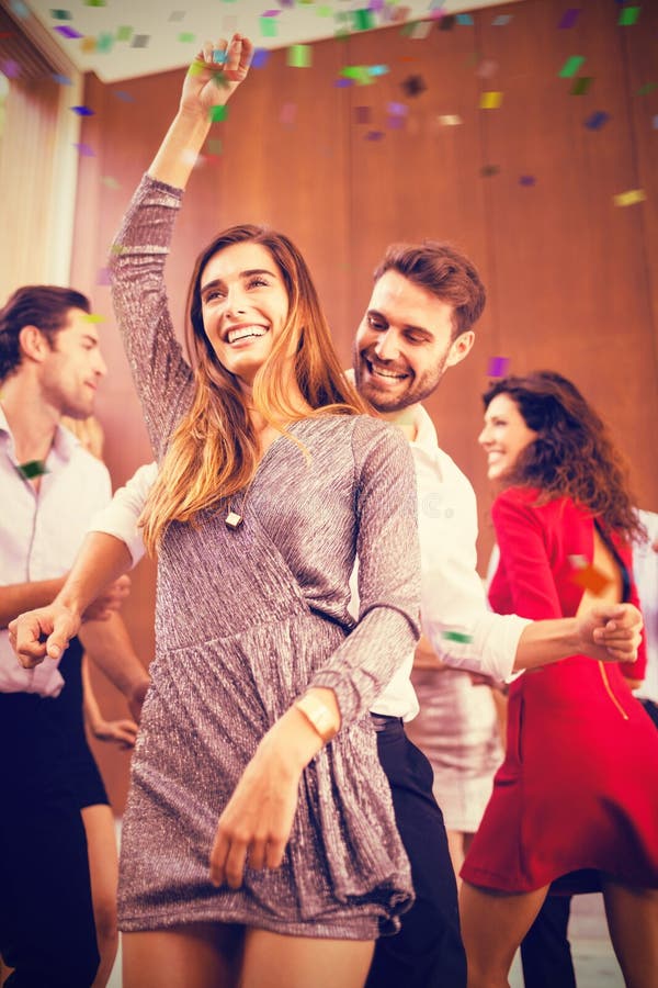 Composite Image of Low Angle View of Young Friends Dancing Stock Photo ...