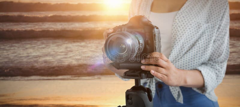 Composite Image of Mid Section of Female Photographer with Digital ...
