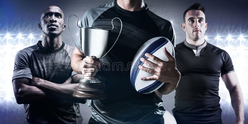 Composite Image of Midsection of Successful Rugby Player Holding Trophy ...