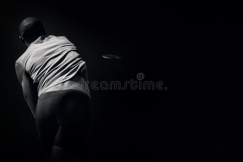 Composite Image of Rear View of Athletic Man Throwing Discus Stock ...