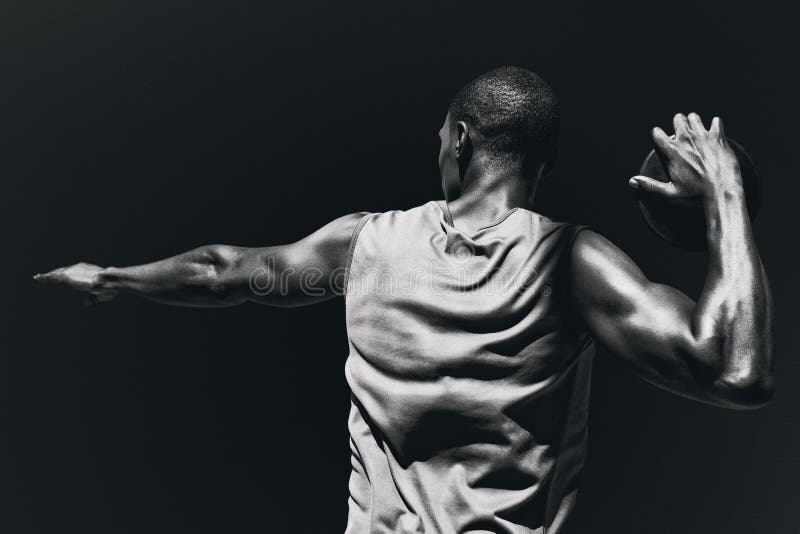 Composite Image of Rear View of Sportsman Practising Discus Throw Stock ...