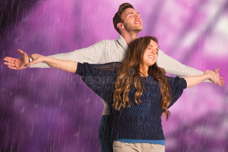 Composite Image of Romantic Young Couple with Arms Out Stock Photo ...