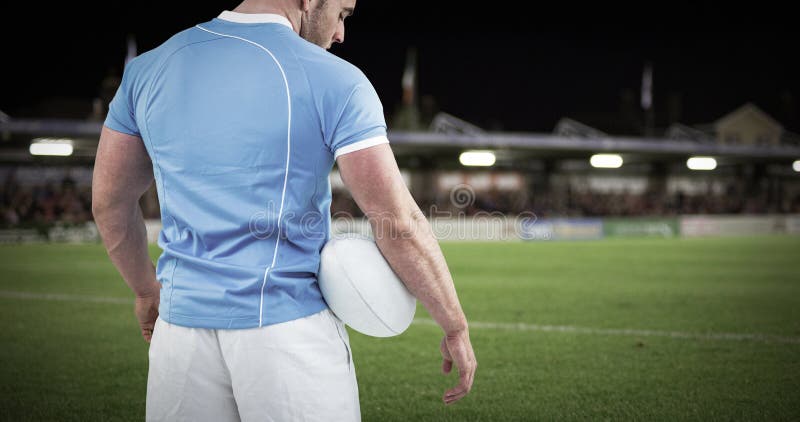 Composite image of rugby player standing with ball - Stock Image ...