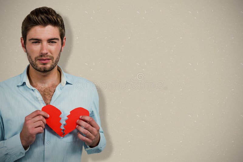 Composite Image of Sad Man Holding Heart Halves Stock Image - Image of ...