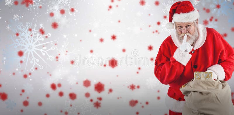 Composite Image of Santa Claus with Finger on Lips and Holding Gifts ...
