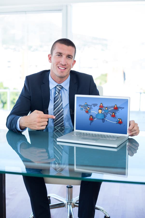 Composite Image of Smiling Businessman Pointing at Laptop Screen in ...