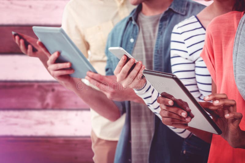 Composite Image of Smiling Creative Team Standing in a Line Using ...