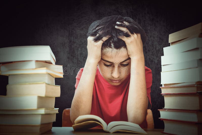 Composite Image of Tensed Boy Sitting with Stack of Books Stock Photo ...