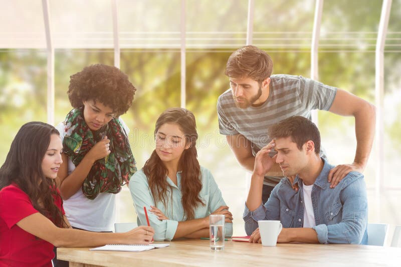 Composite Image of Young Colleagues in Discussion at Office Stock Photo ...