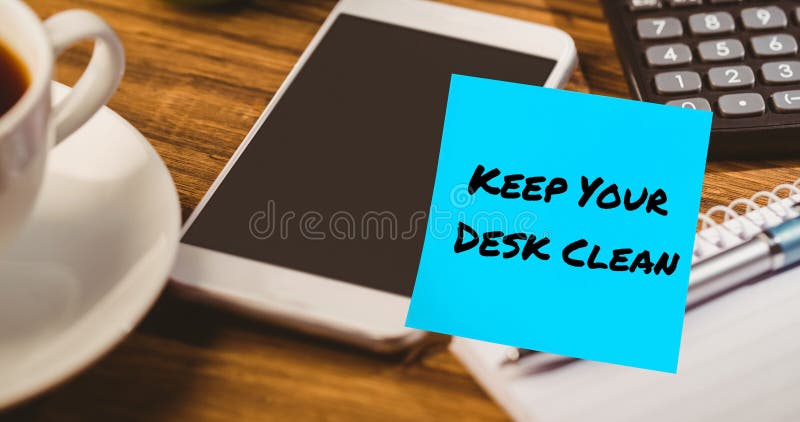 Composite of Keep Your Desk Clean Text on Blue Sticky Note with ...