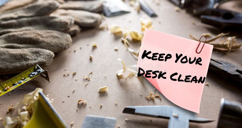 Composite of Keep Your Desk Clean Text on Sticky Note with Carpentry ... Composite of Keep Your Desk Clean Text on Sticky Note with Carpentry ...
