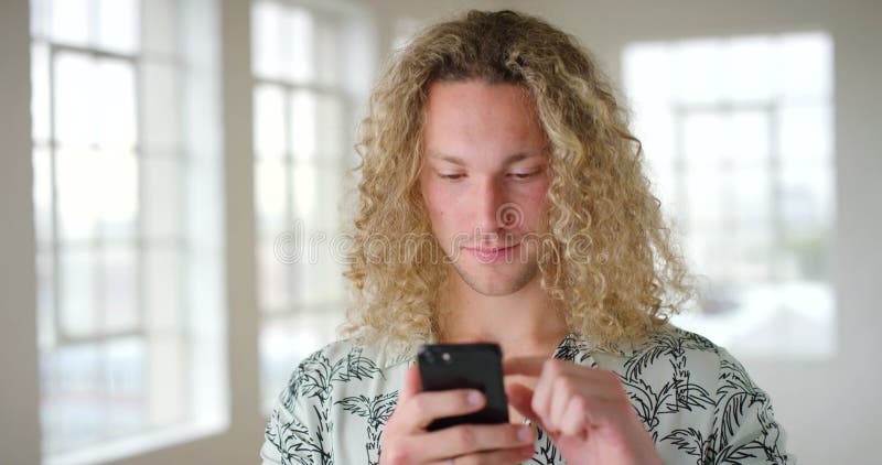 Composite of Laughing Man Texting on a Phone and Browsing Social Media ...