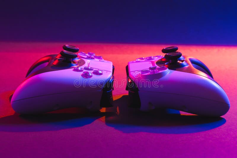 Composite of Video Game Pads and Copy Space on Neon Background Stock ...