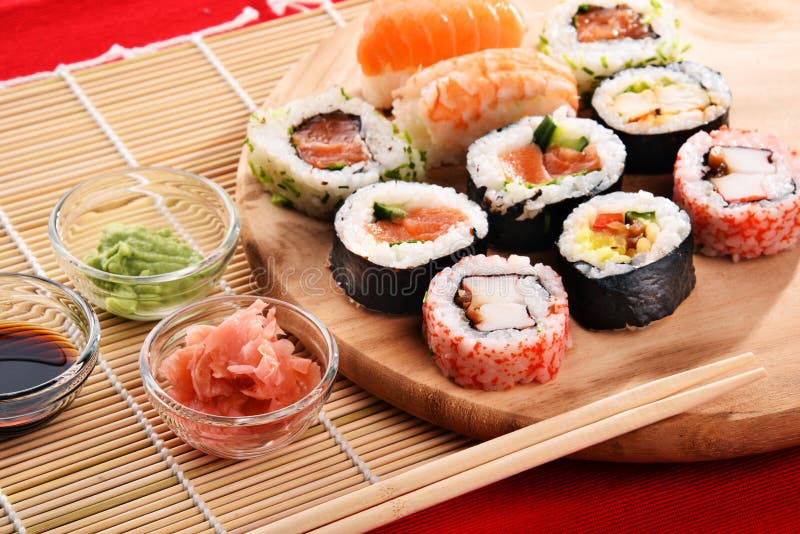 Composition with Assorted Sushi Rolls and Bowls of Spices. Stock Image ...