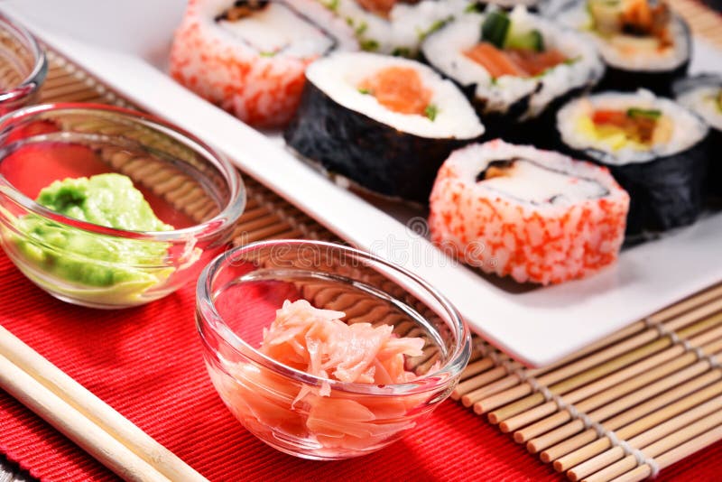 Composition with Assorted Sushi Rolls and Bowls of Spices. Stock Photo ...