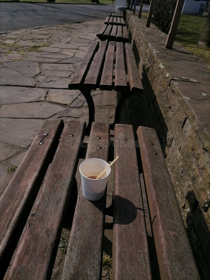 Composition of Benches in One Line and Coffee Cup in Front of the ...