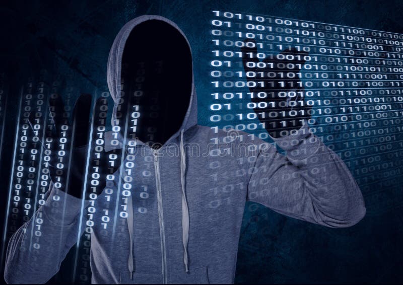 Hacker with Hood Holding a Credit Card and Using a Laptop in Frond of Wood Background with ...
