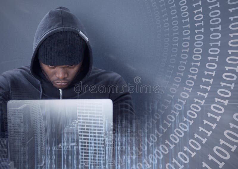 Hacker with Hood Holding a Credit Card and Using a Laptop in Frond of Wood Background with ...