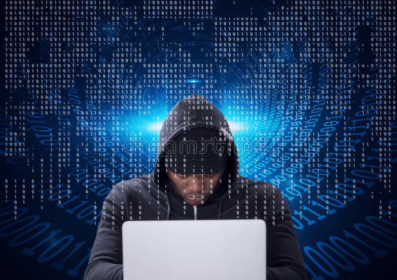 Hacker with Hood Holding a Credit Card and Using a Laptop in Frond of Wood Background with ...
