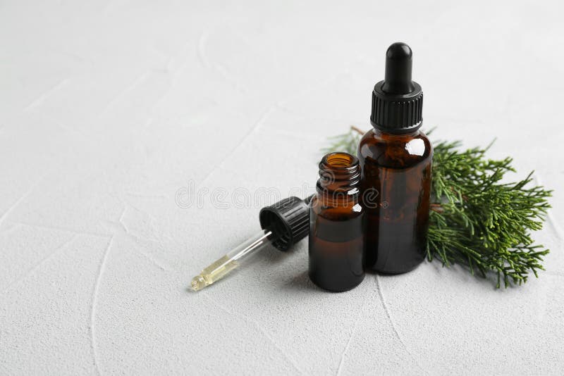 Composition with Bottles of Conifer Essential Oil on Light Background ...