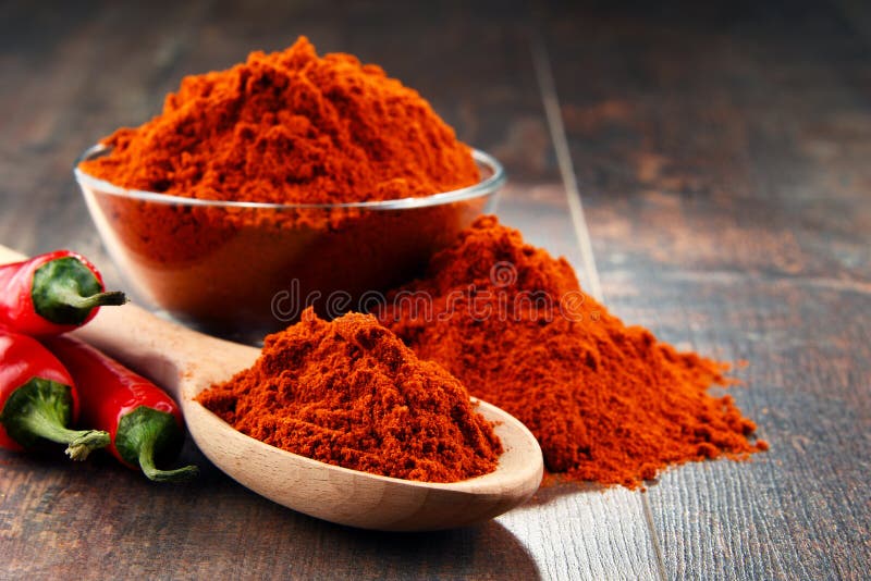 Composition with Bowl of Chili Powder on Wooden Table Stock Photo ...