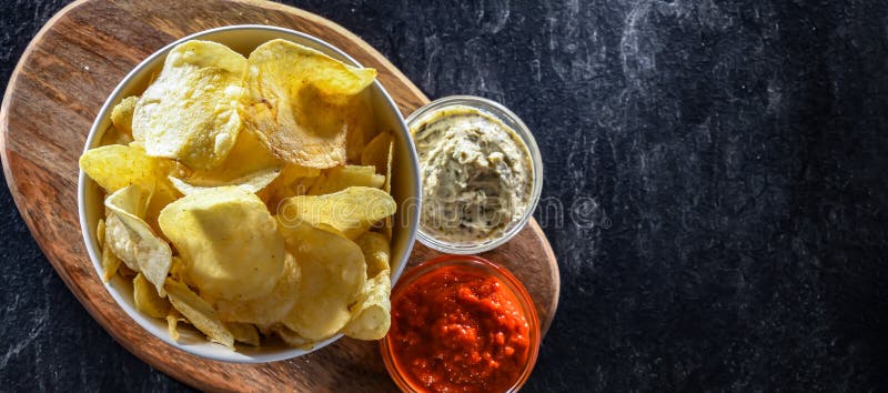 Composition with a Bowl of Potato Chips and Dipping Sauces Stock Image ...