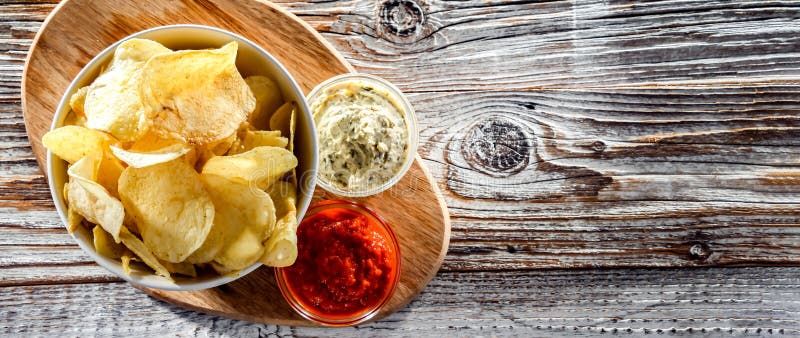 Composition with a Bowl of Potato Chips and Dipping Sauces Stock Image ...