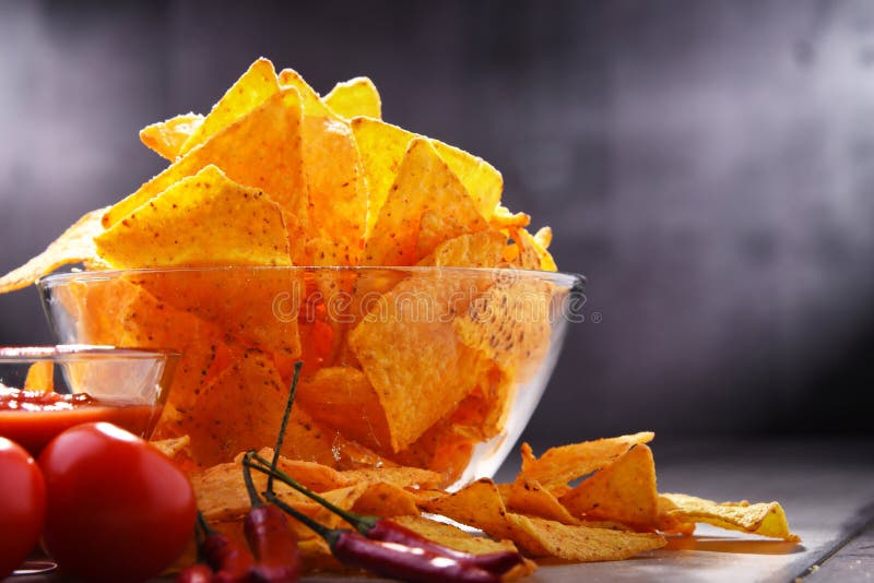 Composition with Bowl of Potato Chips Stock Photo - Image of salsa ...