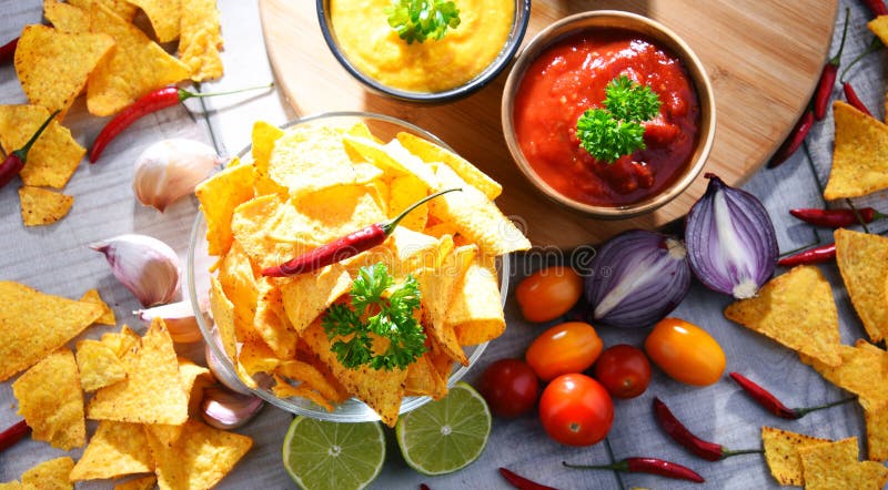 Composition with Bowl of Potato Chips Stock Photo - Image of salsa ...