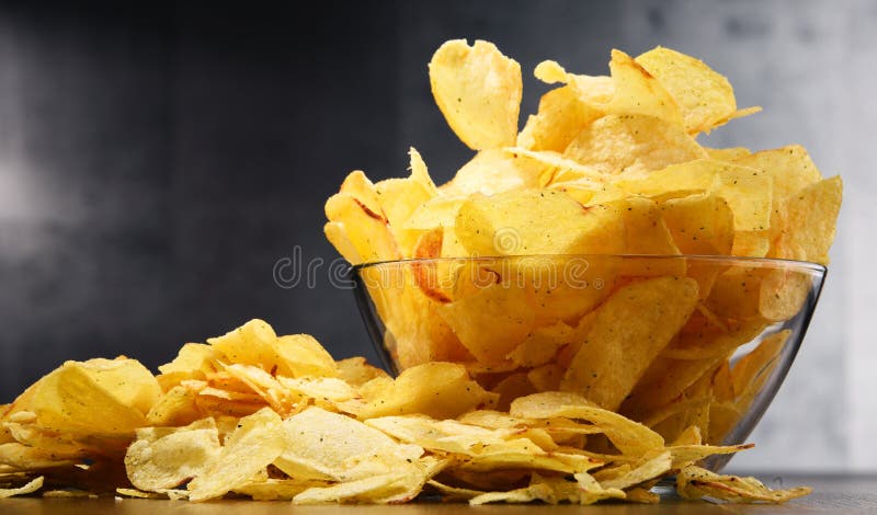 Composition with Bowl of Potato Chips on Wooden Table Stock Image ...