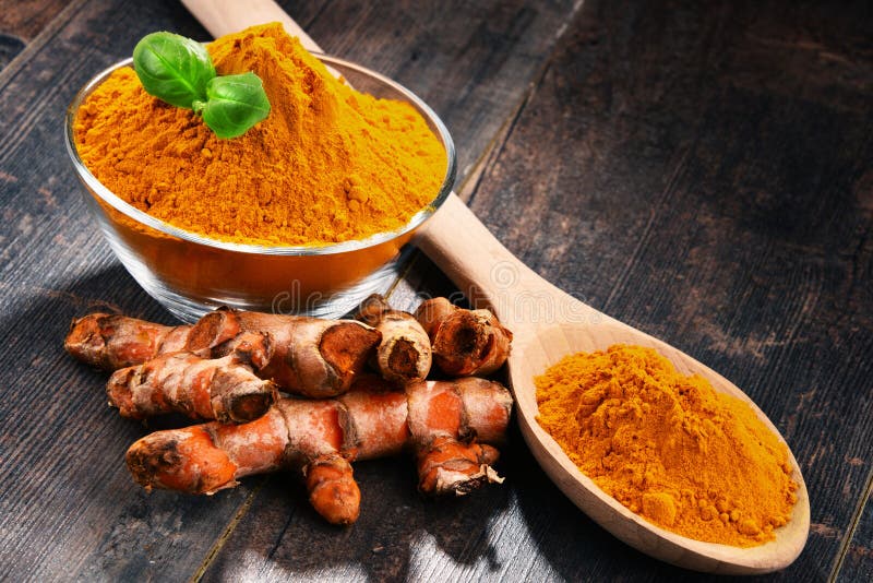 Composition with Bowl of Turmeric Powder on Wooden Table Stock Image ...