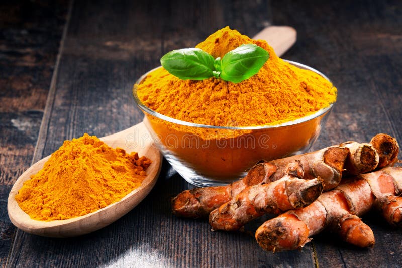 Composition with Bowl of Turmeric Powder on Wooden Table Stock Photo ...