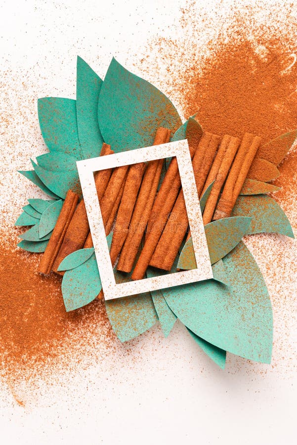 Composition with Cinnamon Sticks, Powder, Green Paper Leaves and Frame ...