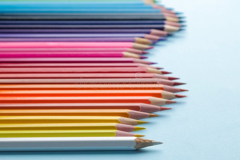 Composition with Colored Pencils on a Bright Blue Background. Close-up ...