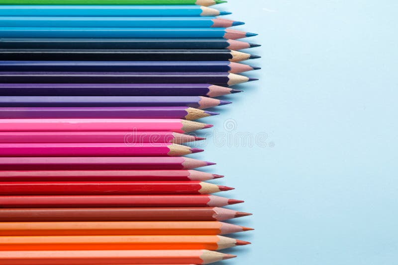 Composition with Colored Pencils on a Bright Blue Background. Top View ...