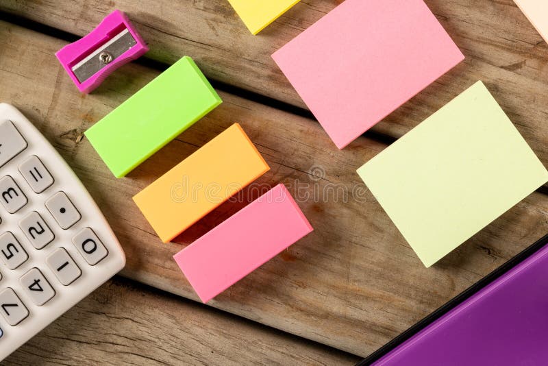 Composition of Colorful Post it Cards and Calculator on Wooden Surface ...