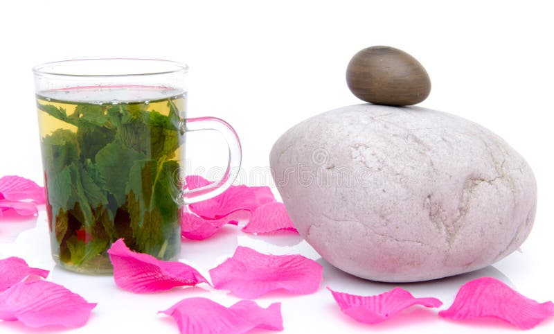 Composition with a Cup of Mint Tea, Pebbles and Pink Petals Stock Photo ...
