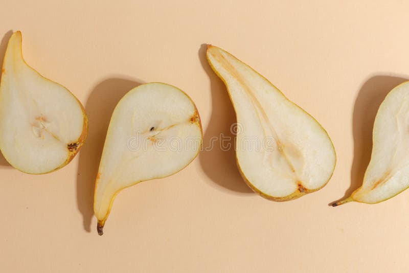 Composition of Cut Pears on a Beige Background. Top View Stock Photo ...