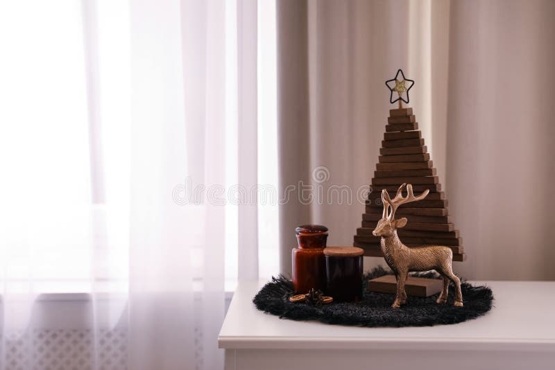 Composition with Decorative Christmas Tree and Reindeer Near Window ...