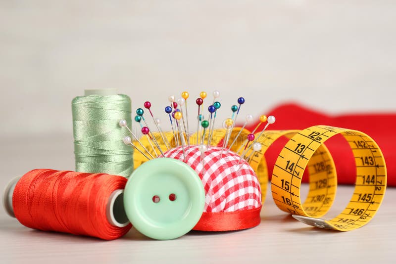 Composition with Different Sewing Items on Light Beige Table Stock ...