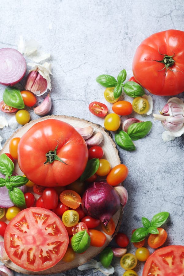 Composition of Different Tomatoes, Onion, Basil and Garlic Stock Photo ...