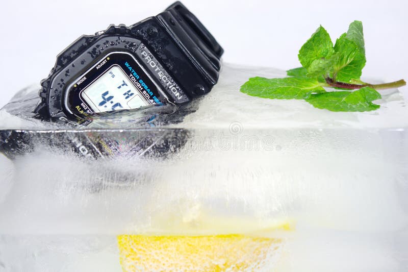 Composition of Digital Wristwatch, Lemon and Mint in Ice Cube Stock ...